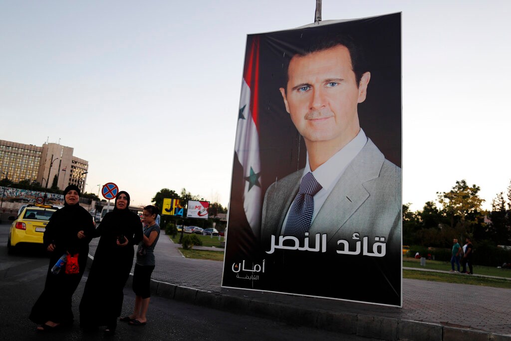 Assad's victory posters crowd Damascus streets - cnbctv18.com