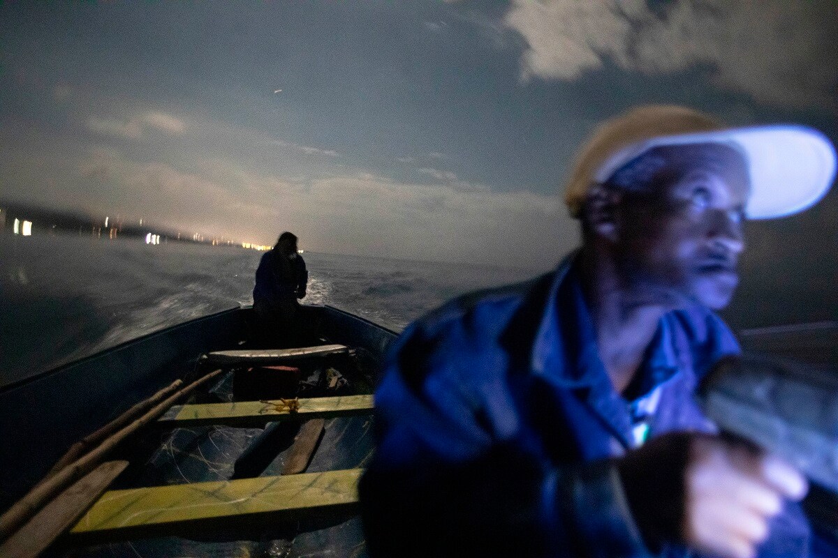 Night fishing in Jamaica's moonlit sea in eerie silence - cnbctv18.com