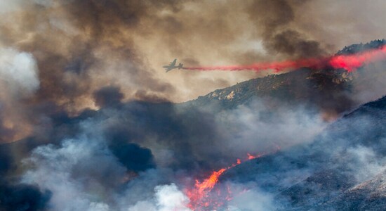 In pictures: Wildfires race through dry, windy California
