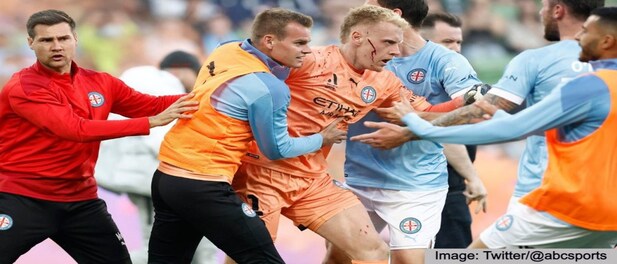 Watch | Goalkeeper Tom Glover suffers head injury during pitch invasion ...